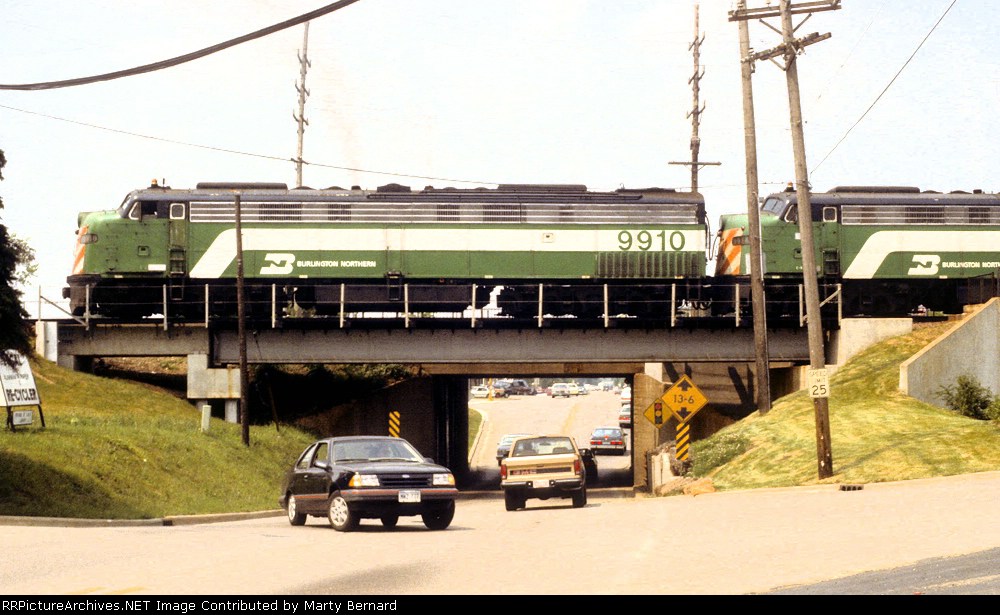 BN 9910 (ex-CB&Q 9985B) Crossing Over Main St. With Tr# 1256